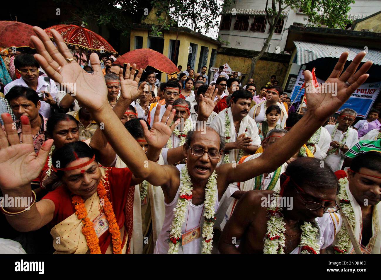 Hindu devotees dance during a chariot procession of lord Jagannath in ...
