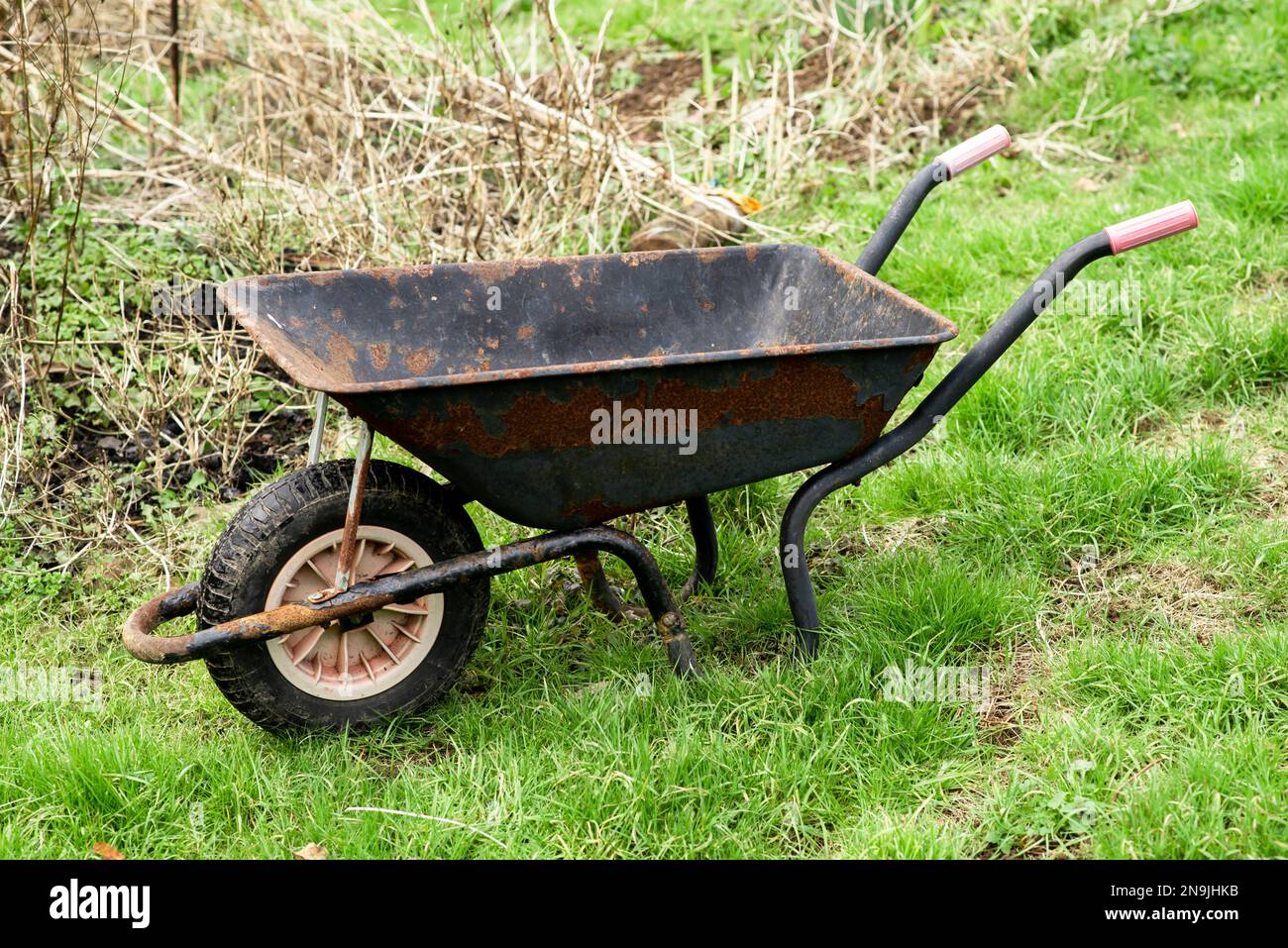 Retro rusty garden barrow hi-res stock photography and images - Alamy
