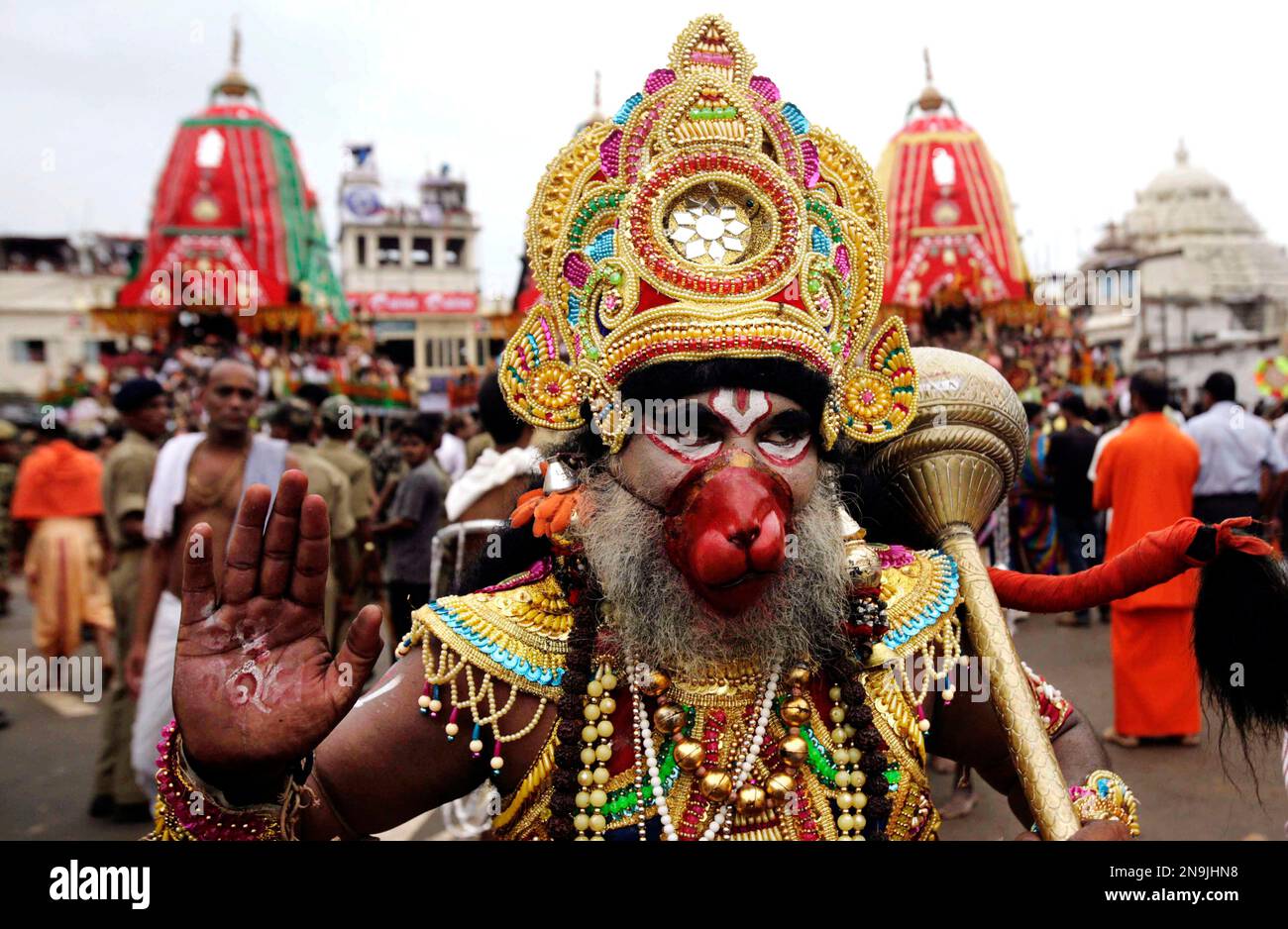 An Indian man dressed up as monkey god Hanuman takes part in the annual ...