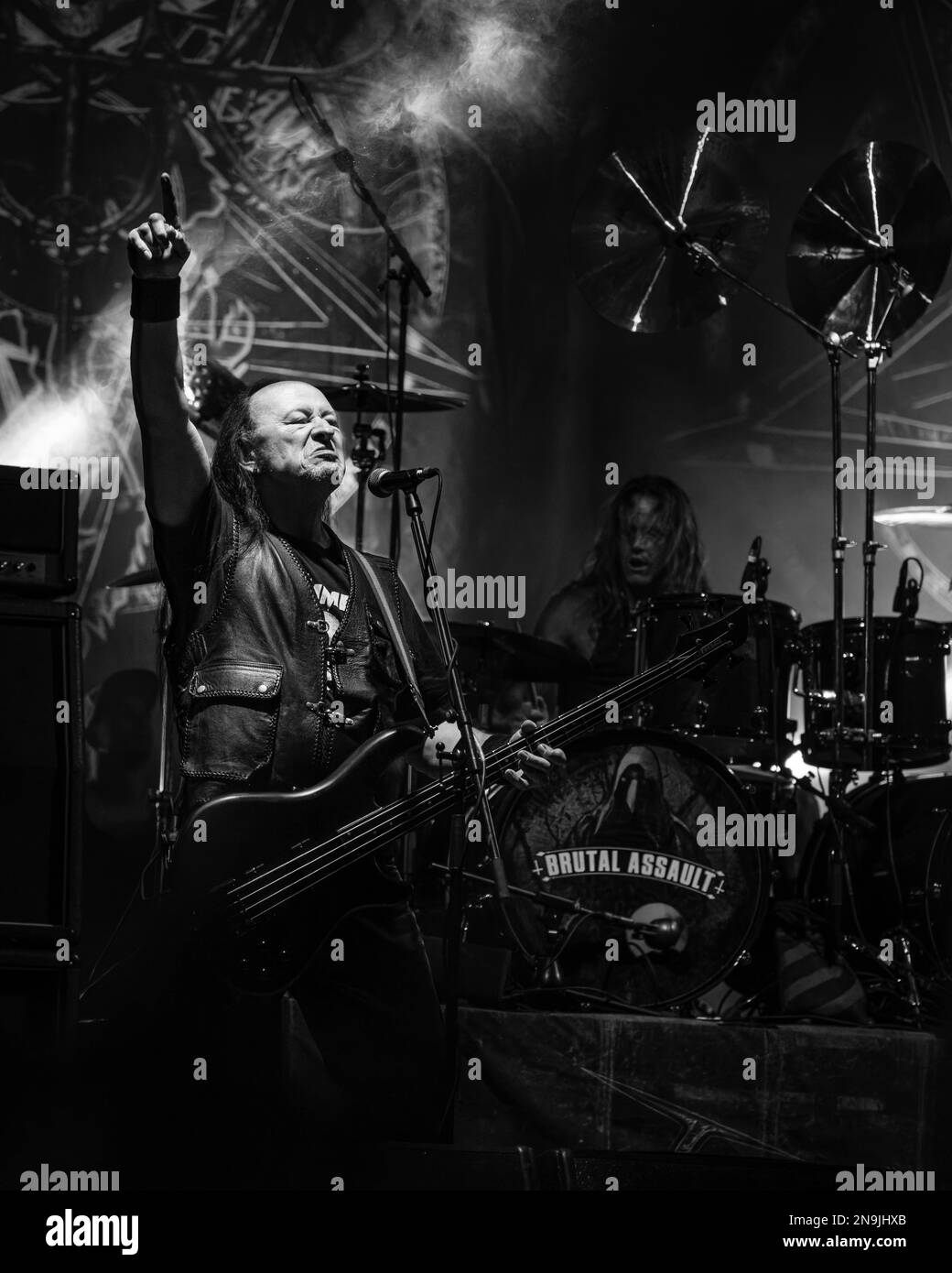 A vertical grayscale shot of Venom performing at the Brutal Assault ...