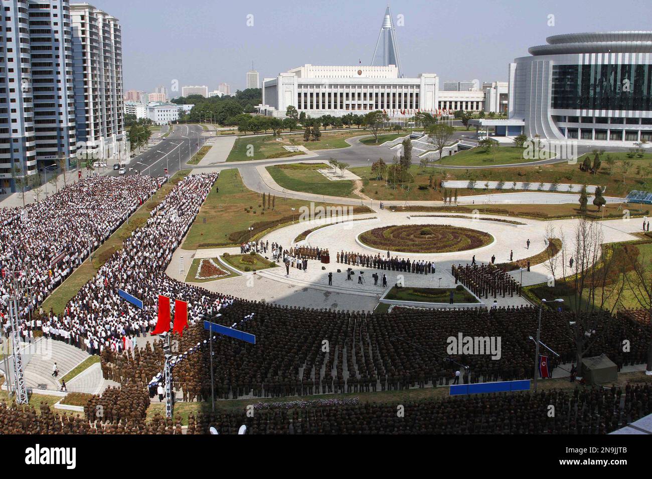 In this Wednesday, June 20, 2012 photo, North Koreans gather under ...