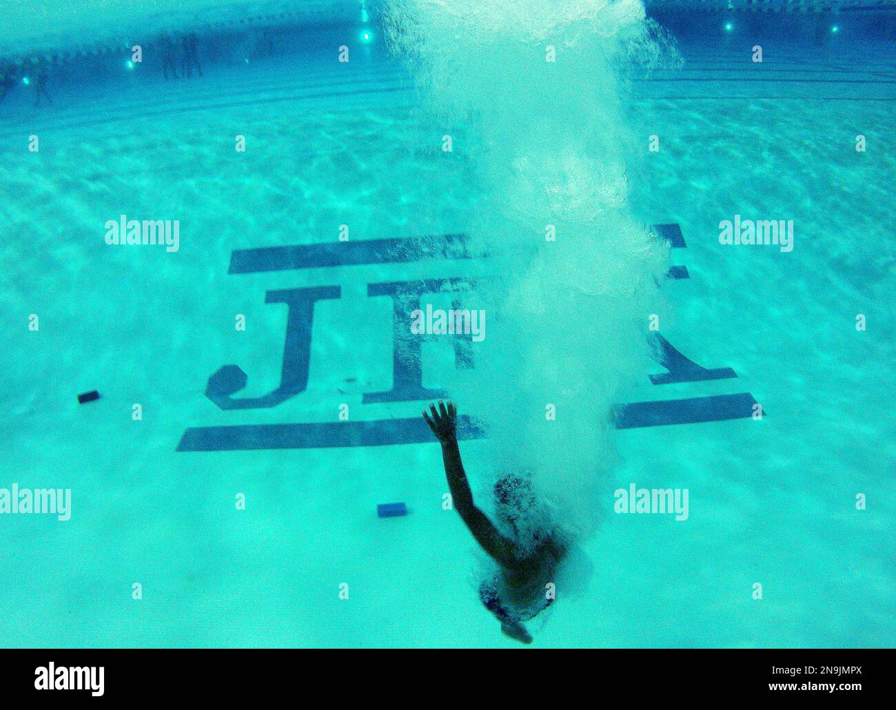 Keyonn Hopkins, 10, dives into a pool at the John F. Kennedy Aquatic ...