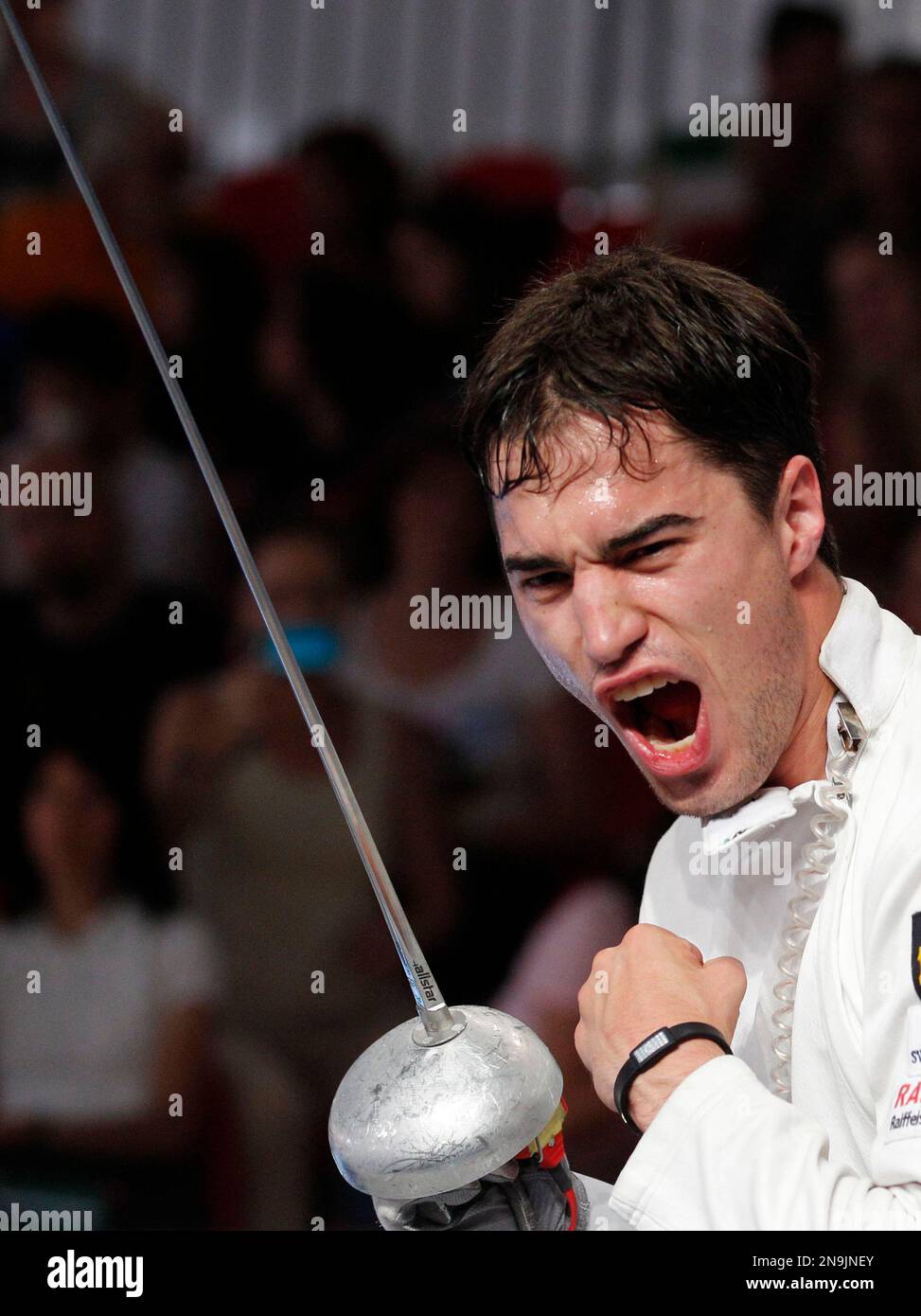 Max Heinzer, of Switzerland, celebrates after winning the gold medal in ...