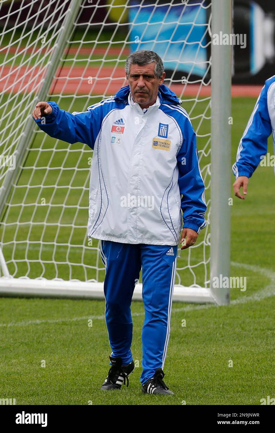 Greece's coach Fernando Santos gives directions to his players during a ...