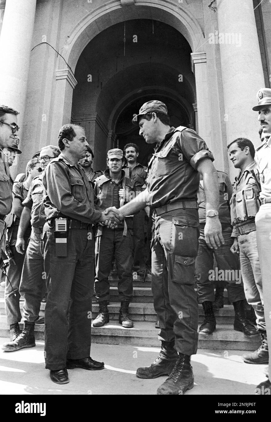 Lebanese Army Colonel Michel Aoun, left, shakes hands with Israeli ...