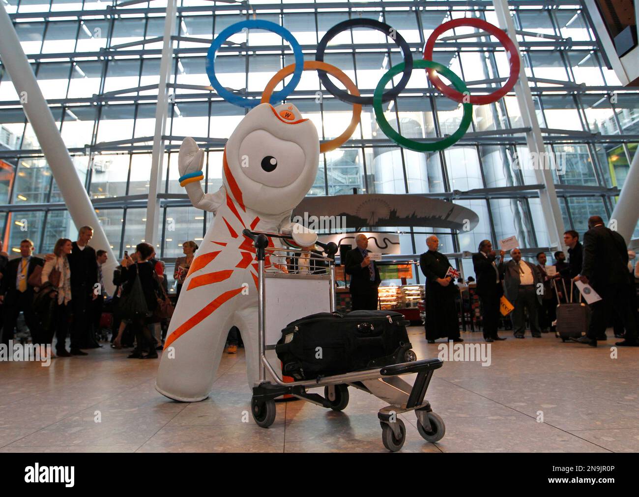 The London 2012 Olympic mascot Wenlock poses under giant Olympic Rings ...