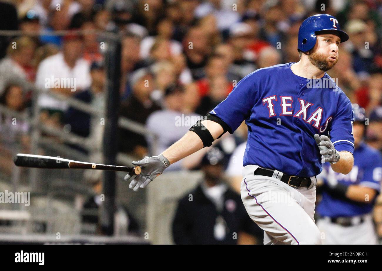 Texas Rangers pitcher Scott Feldman drives an RBI single down the right ...