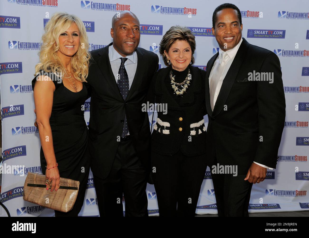 Byron Allen, second from left, head of Entertainment Studios, poses ...