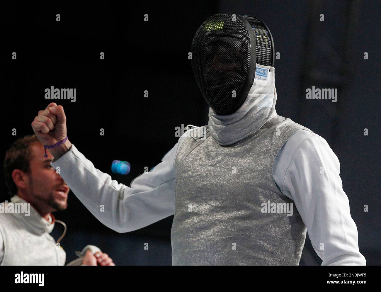Andrea Cassara' of Italy, celebrates a point as he competes with Victor ...