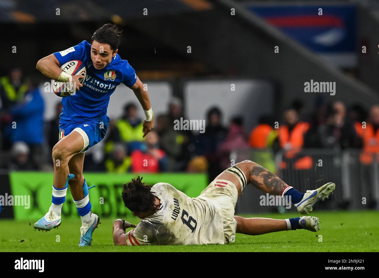 Ange Capuozzo of Italy evades the tackle of Lewis Ludlam of England ...
