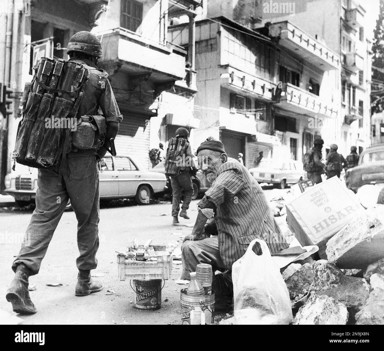 A Lebanese cigarette vendor sits on an empty box in West Beirut, on ...