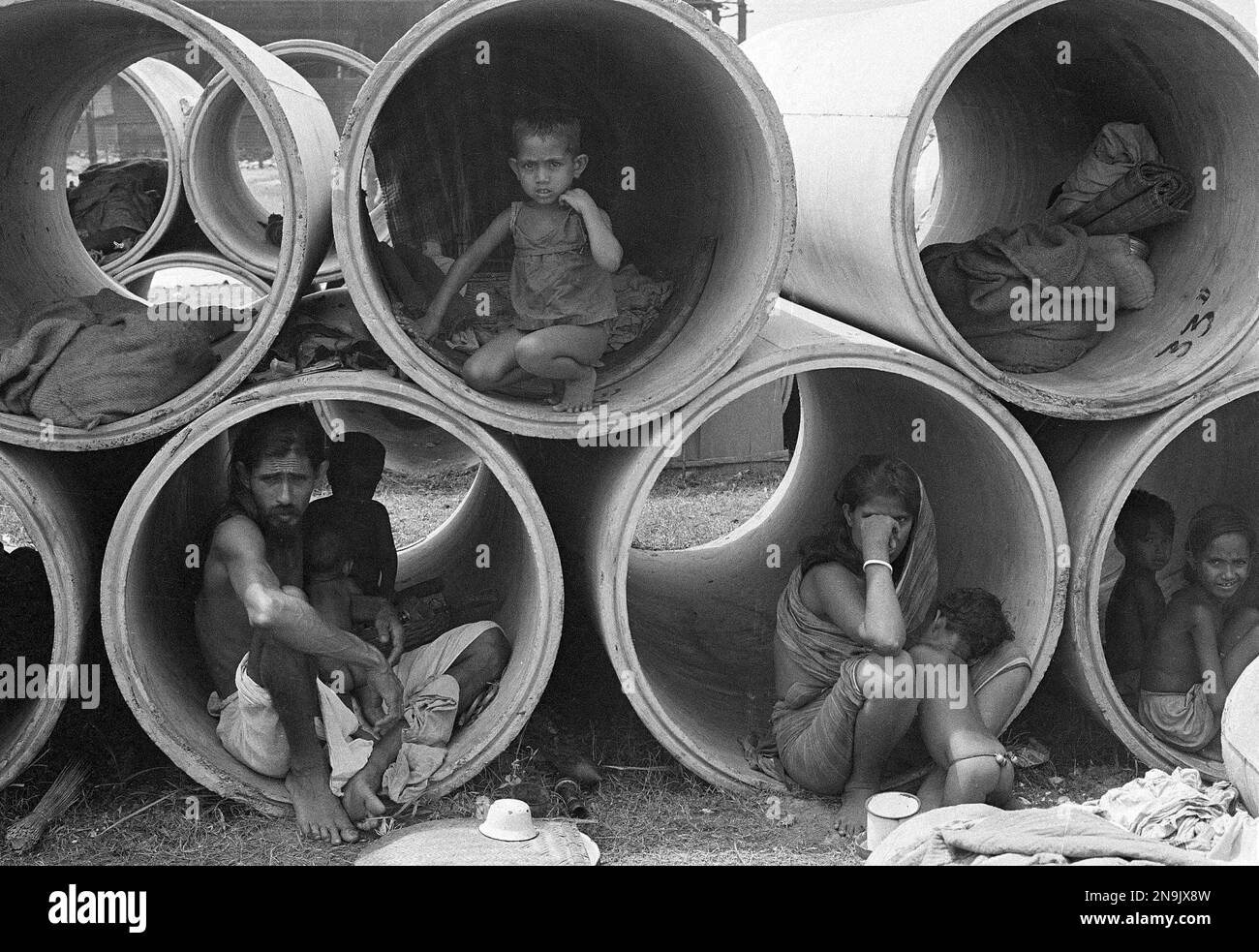 Large concrete drainage pipes are used as temporary housing for ...