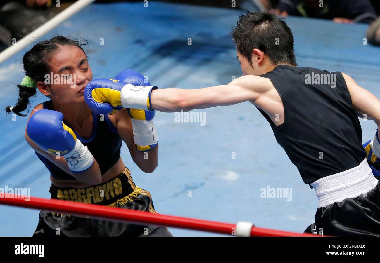 Japanese champion Momo Koseki, right, lands a left to Philippine ...