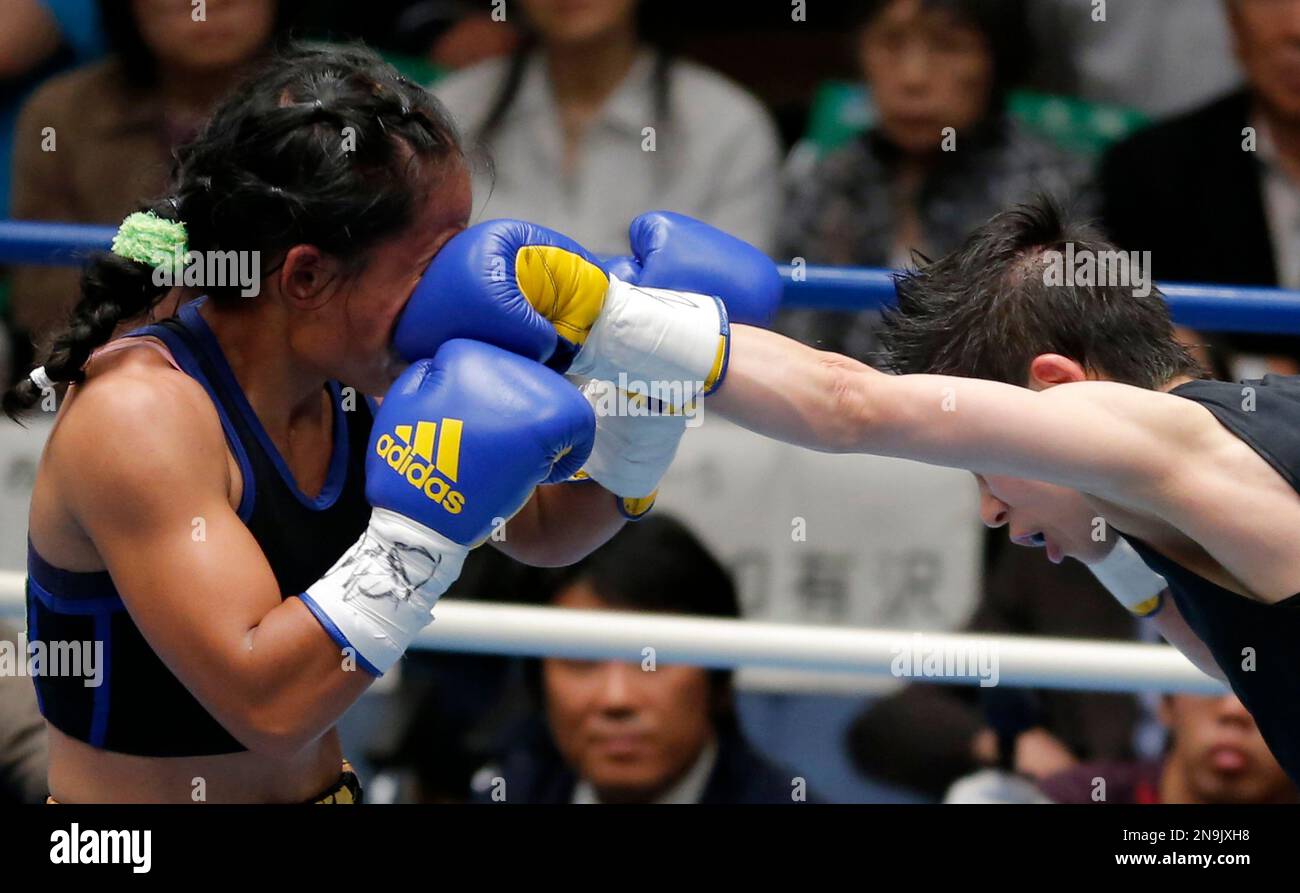 Japanese champion Momo Koseki, right, lands a left on the face of ...