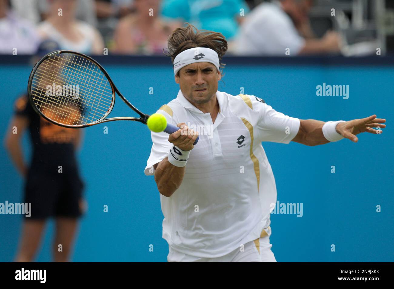 David Ferrer of Spain returns in his match against at Pierre-Ludovic ...