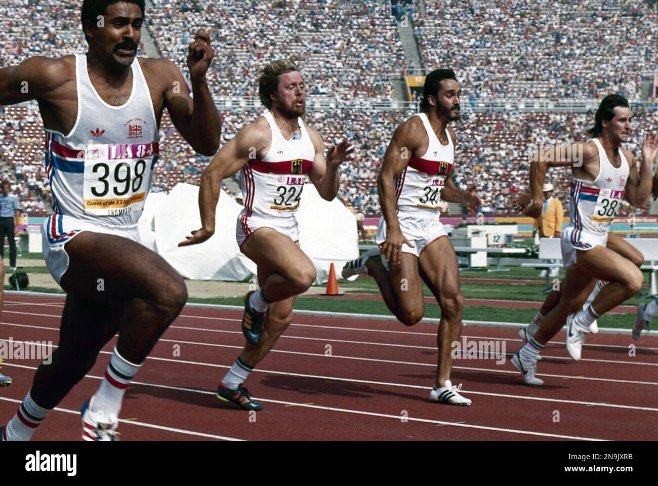 Britain's Daley Thompson (398), left, wins his heat in the 100 Meter ...