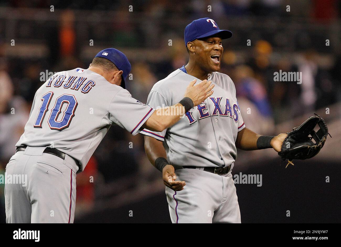 Texas Rangers' Adrian Beltre, right, and Michael Young celebrate after ...