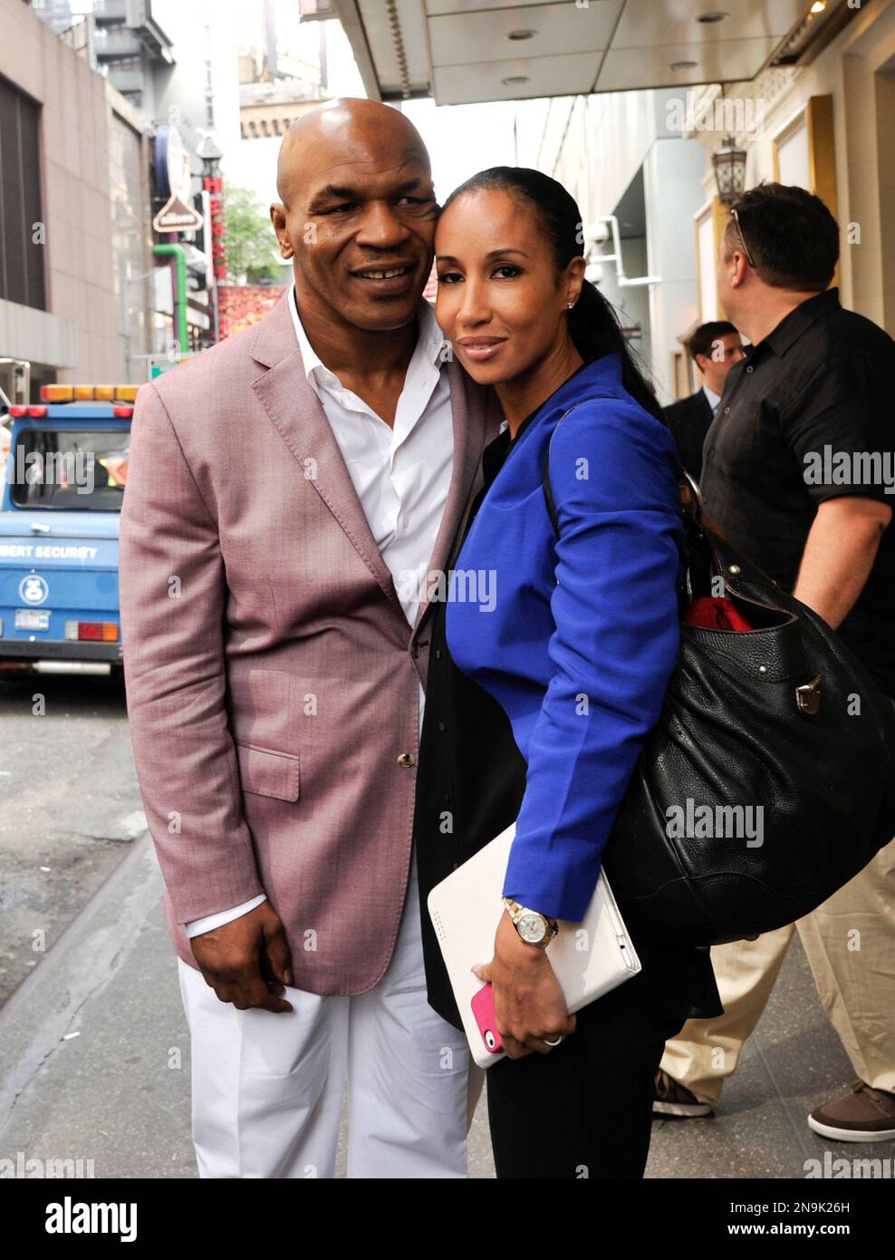 Former heavyweight boxer Mike Tyson and wife Kiki Tyson pose together ...