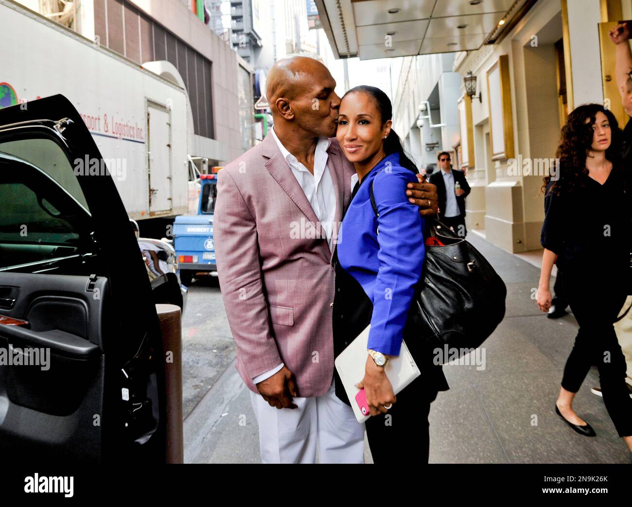 Former heavyweight boxer Mike Tyson and wife Kiki Tyson pose together ...
