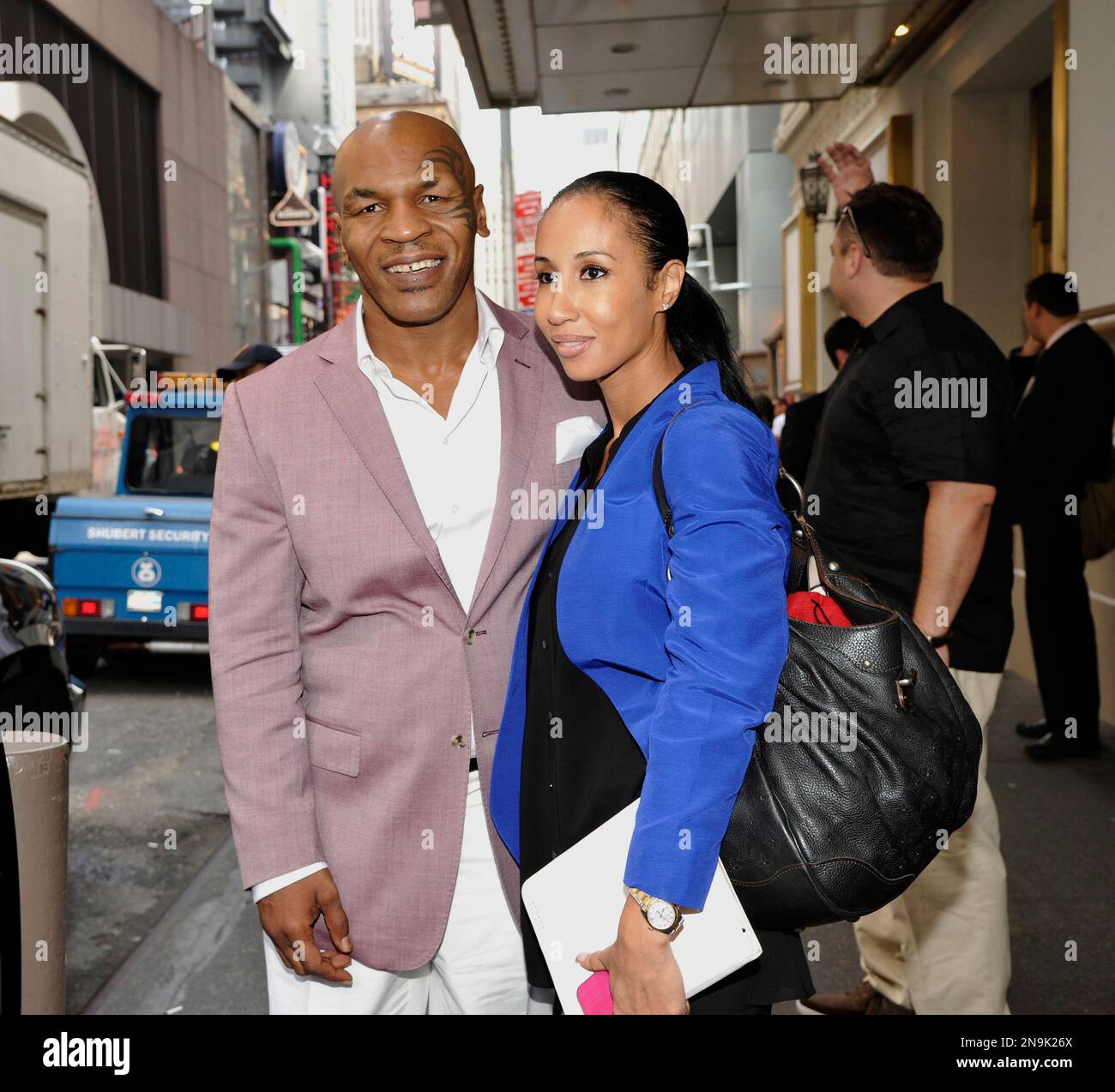Former heavyweight boxer Mike Tyson and wife Kiki Tyson pose together ...