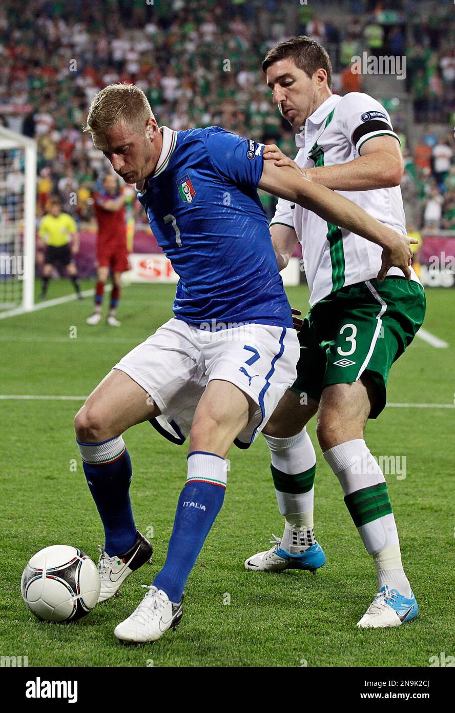 Italy's Ignazio Abate controls the ball in front of Ireland's Stephen ...