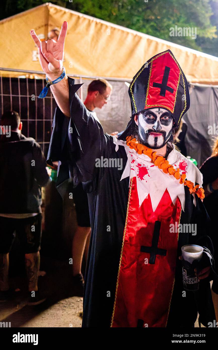 A vertical shot of a fan in an evil pope costume at the Brutal Assault ...