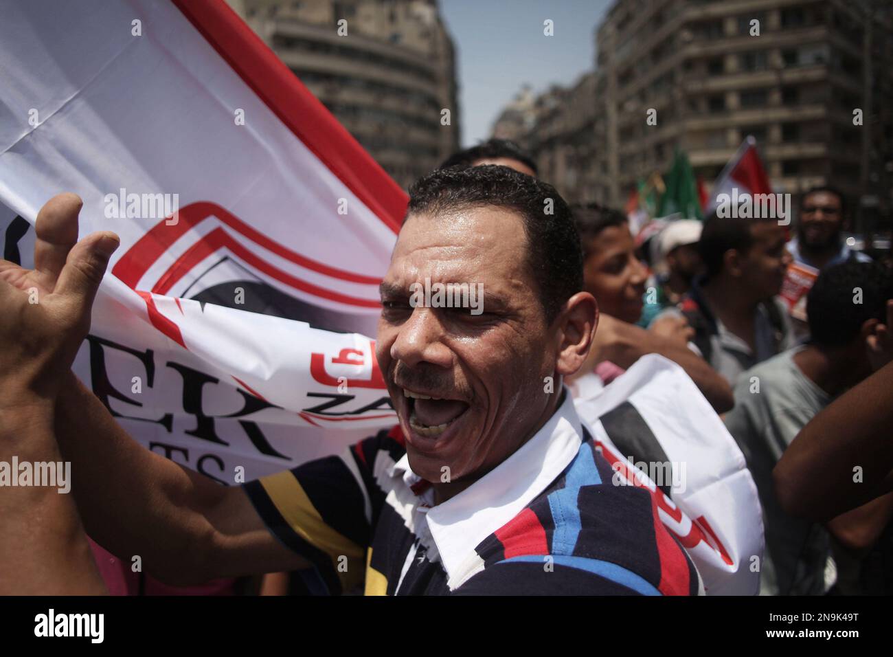 Egyptian supporters of Islamist candidate Mohammed Morsi chant slogans ...