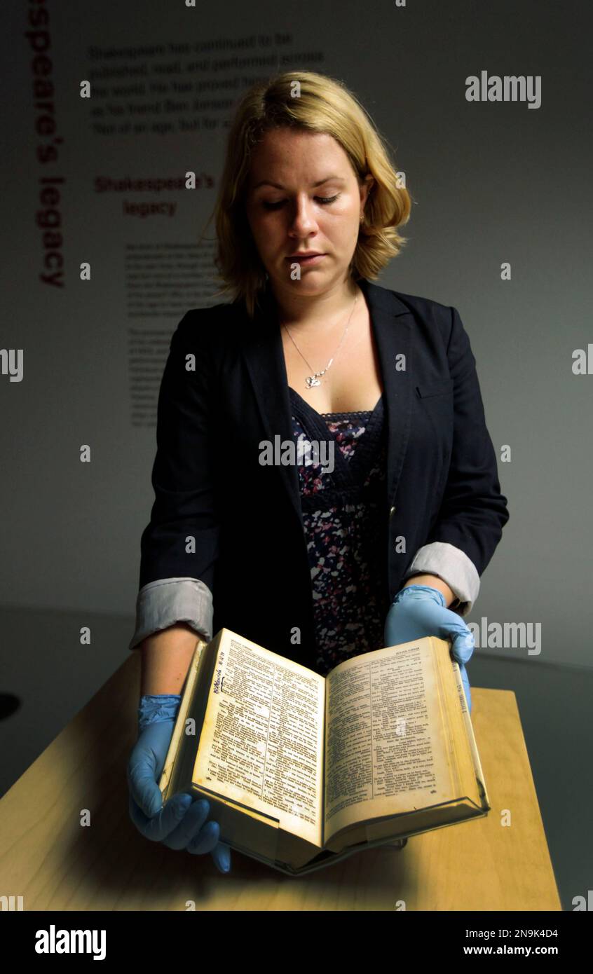 Becky Allan, project curator of the British Museum, holds an edition of ...