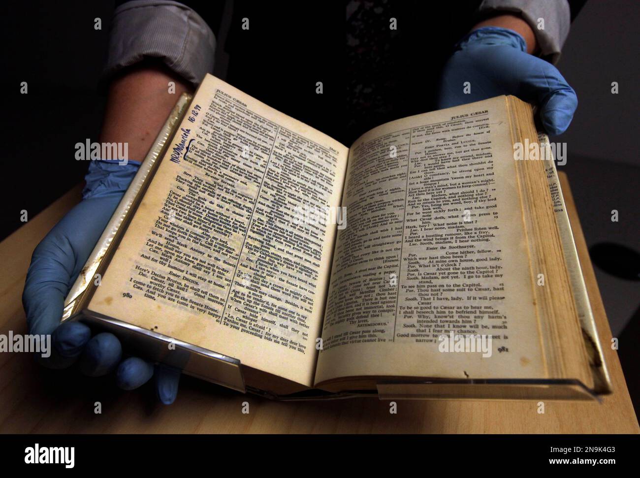 Becky Allan, project curator of the British Museum, holds an edition of ...