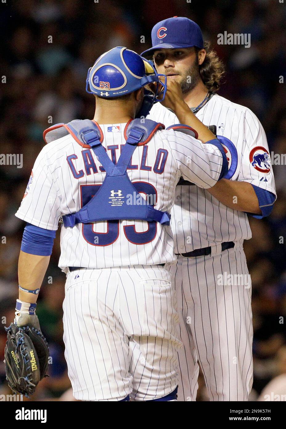 Chicago Cubs relief pitcher James Russell, right, listens to catcher ...