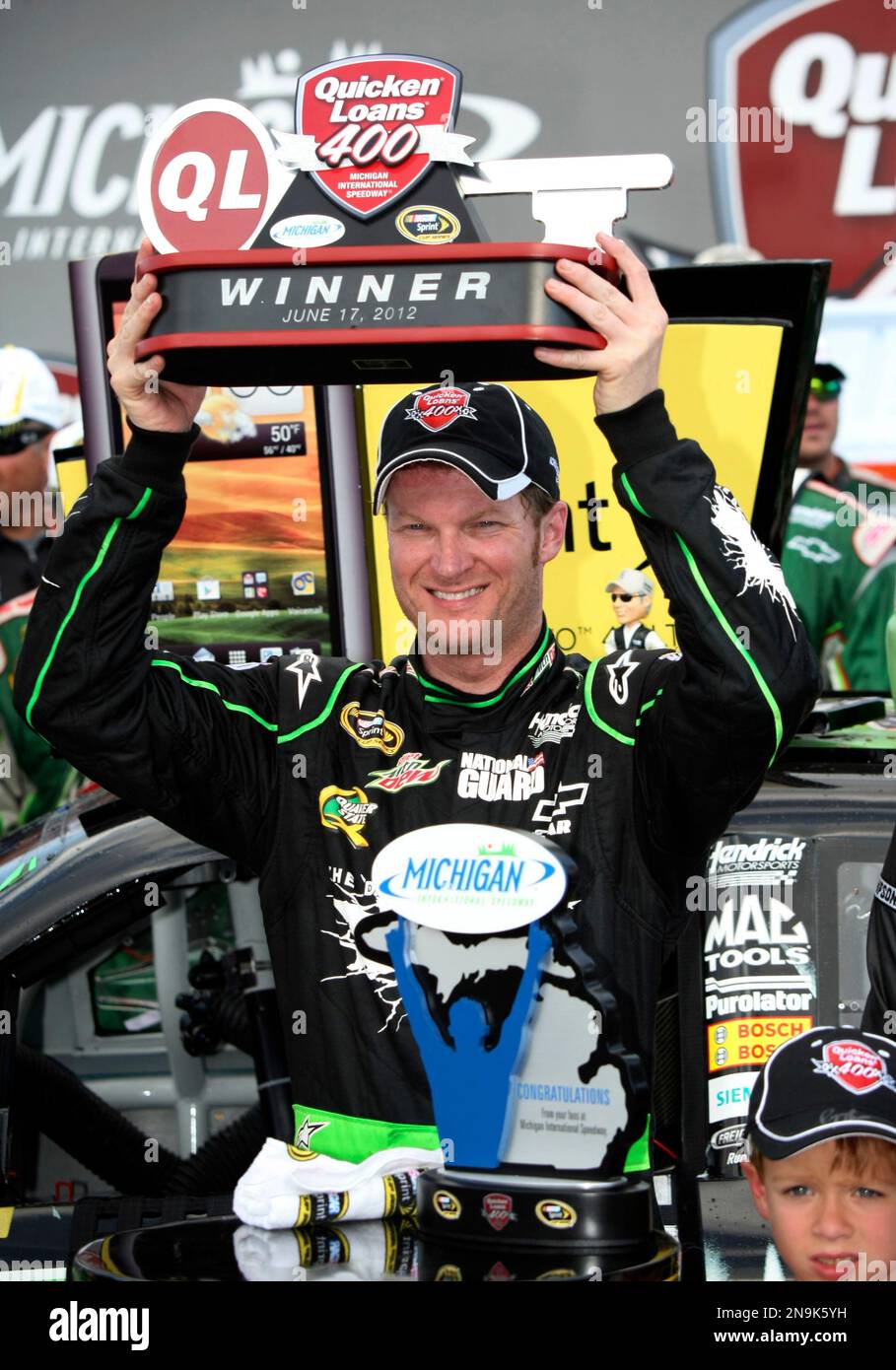 Dale Earnhardt Jr. lifts the trophy after winning the NASCAR Sprint Cup ...