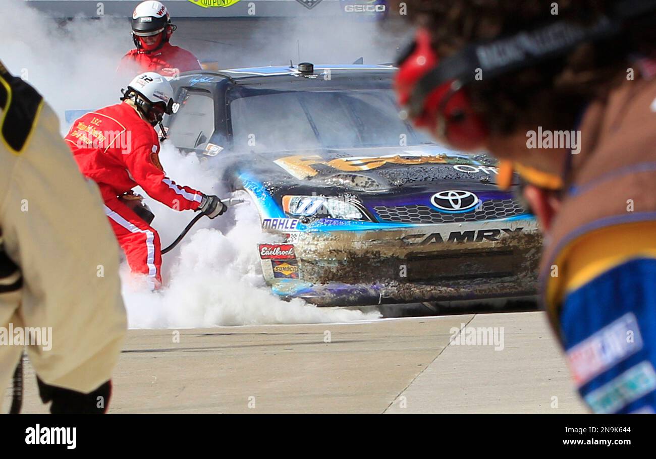 NASCAR driver Denny Hamlin car flames up on pit road during the Quicken ...