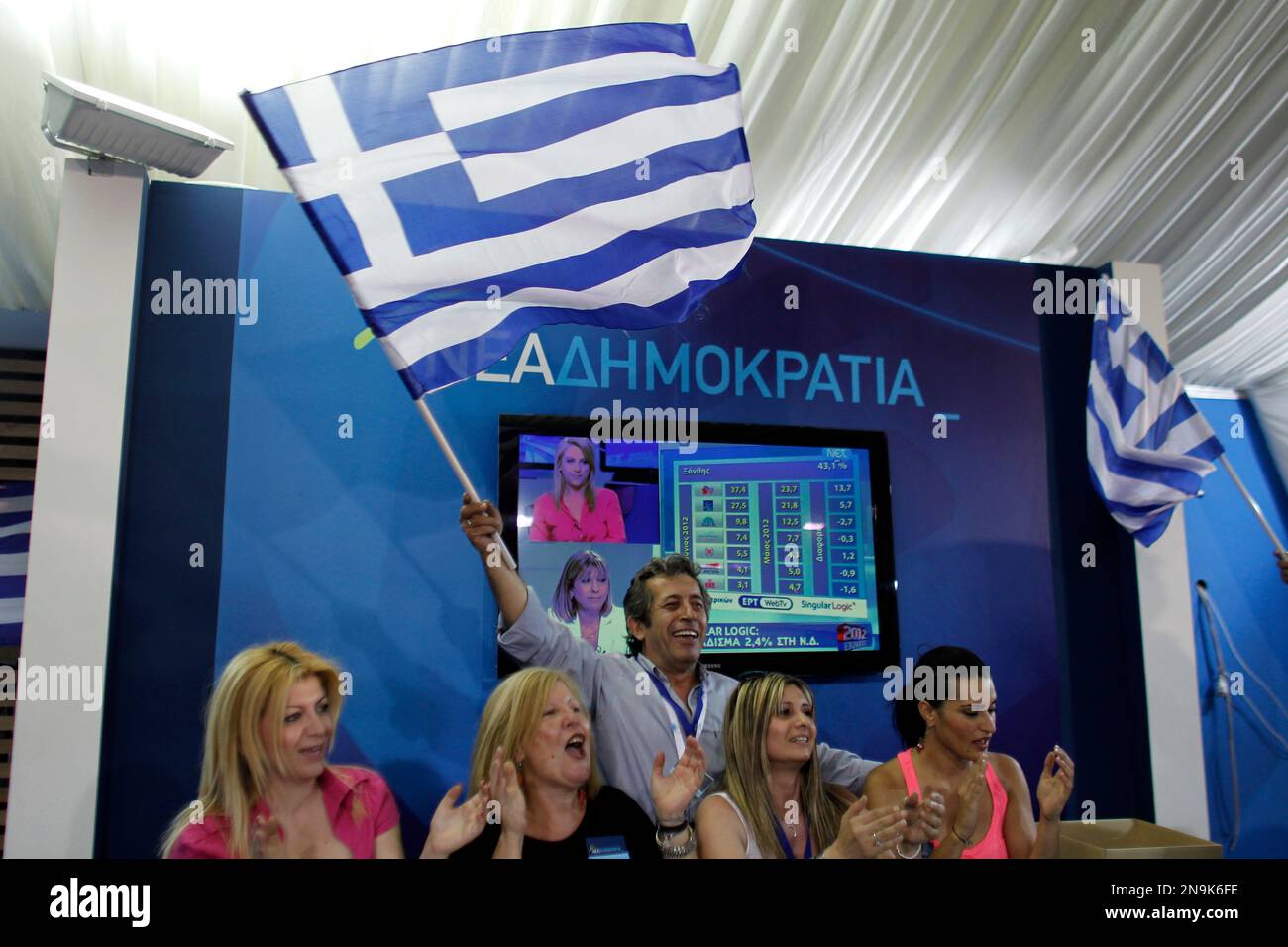 Supporters of the New Democracy conservative party celebrate at an ...