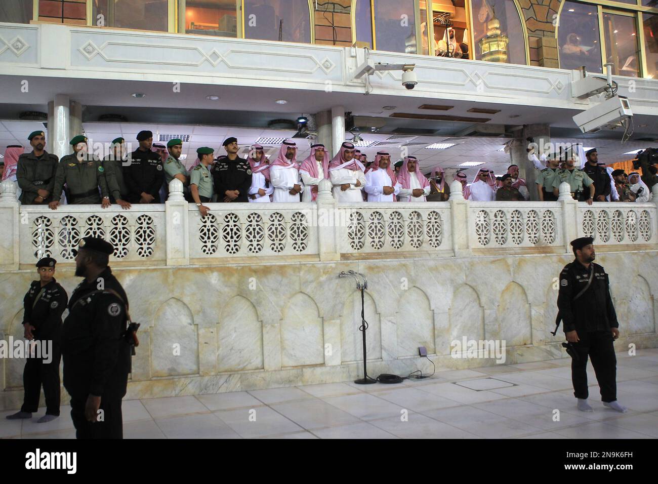 Relatives from the Saudi royal family pray during the funeral of the ...