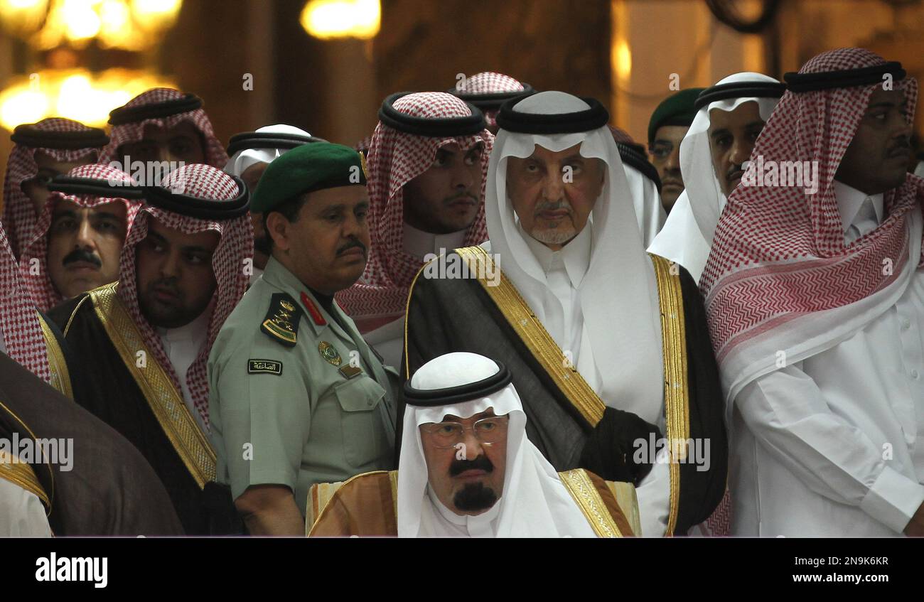King Abdullah of Saudi Arabia, center bottom, attends with other royal ...