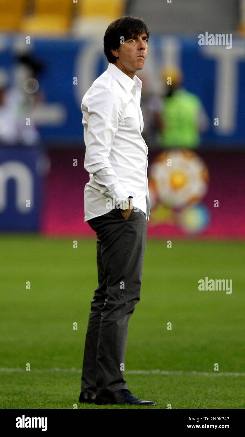 Germany head coach Joachim Loew looks up as he inspects the pitch prir ...