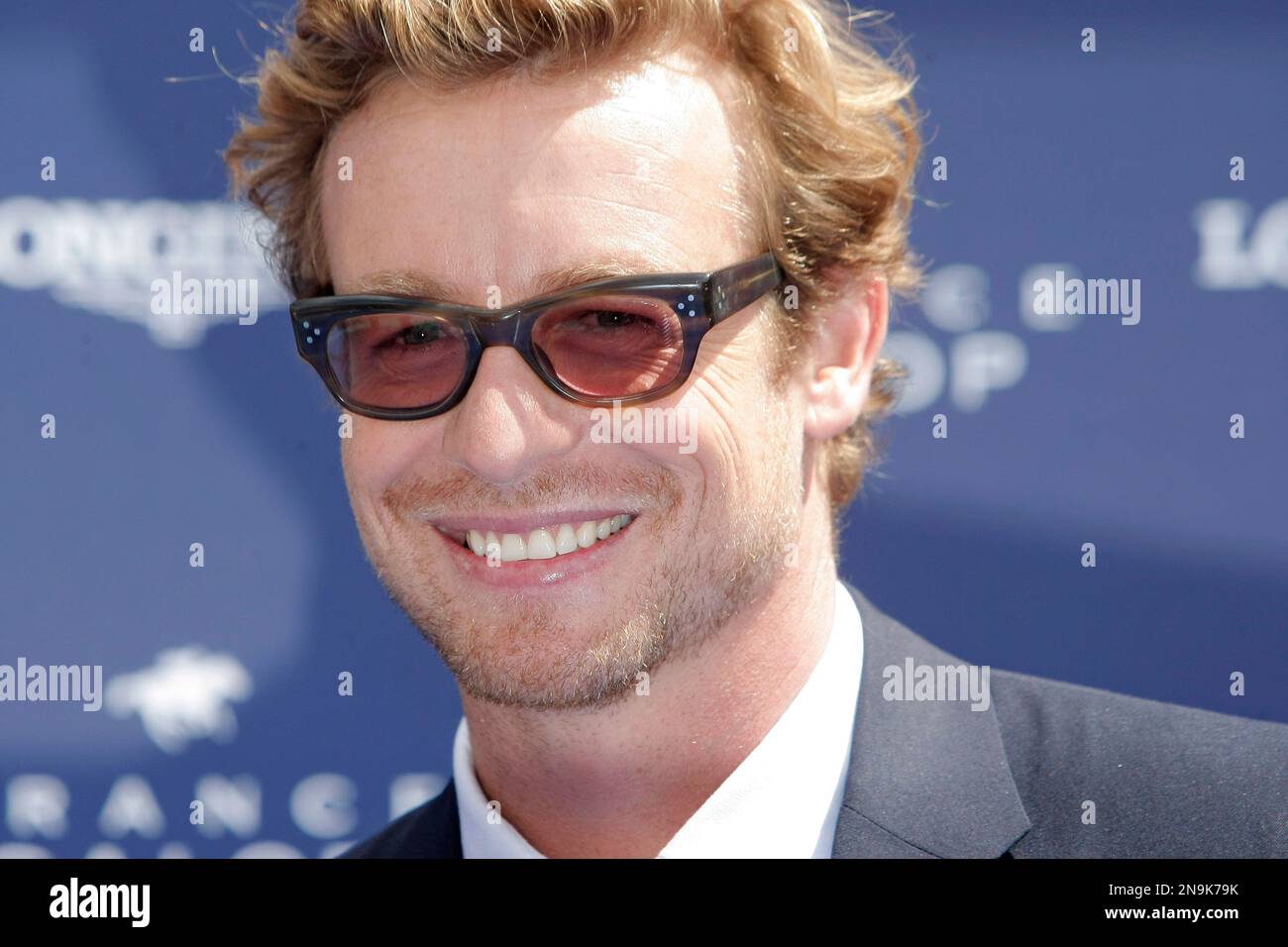 Australian actor Simon Baker poses prior to the Prix de Diane horse ...