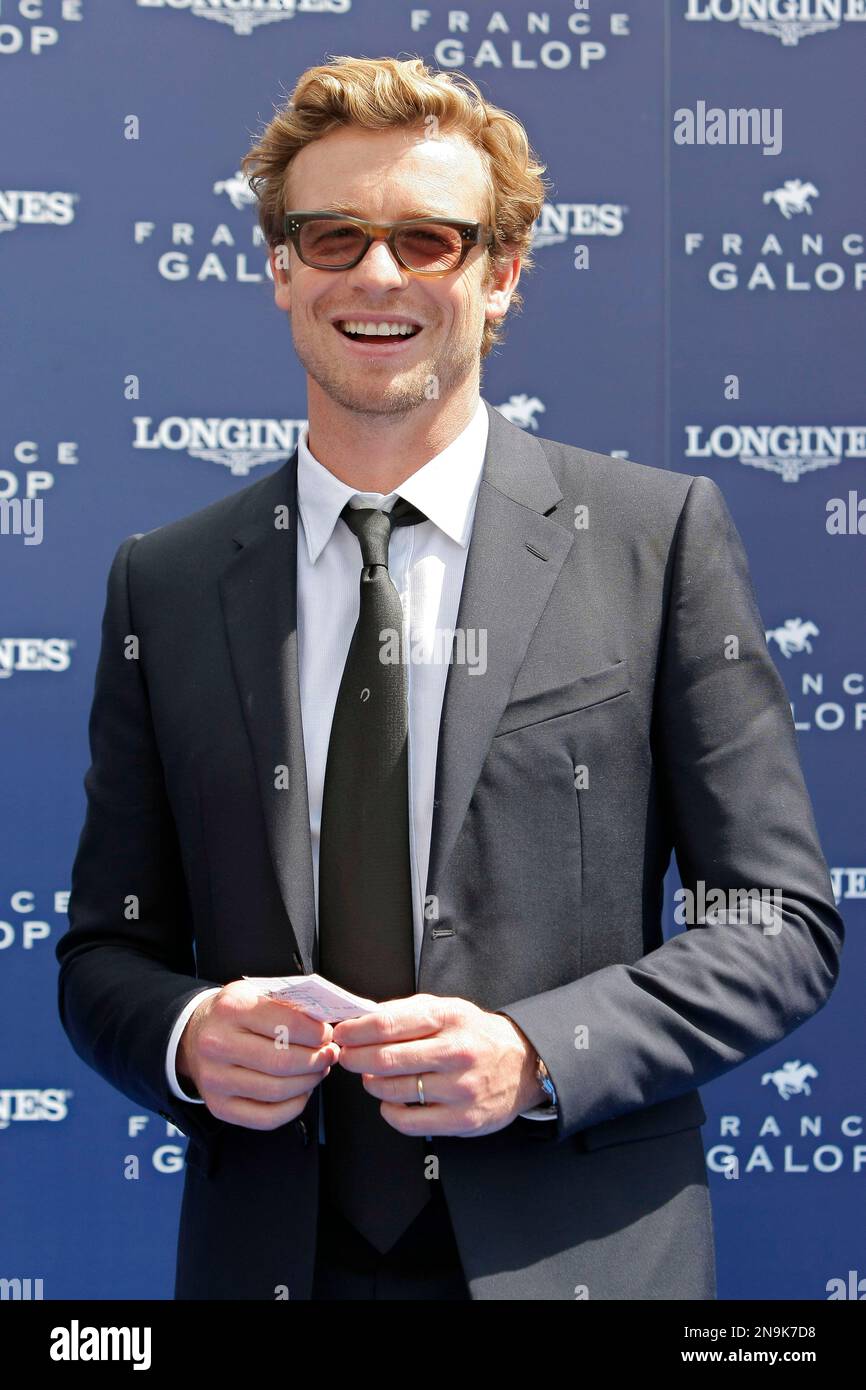 Australian actor Simon Baker poses prior to the Prix de Diane horse ...