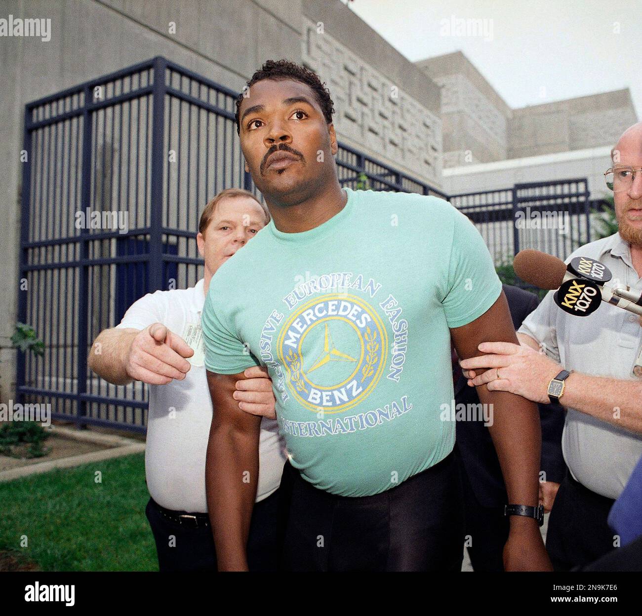 FILE - This July 16, 1992 file photo shows Rodney King being escorted ...