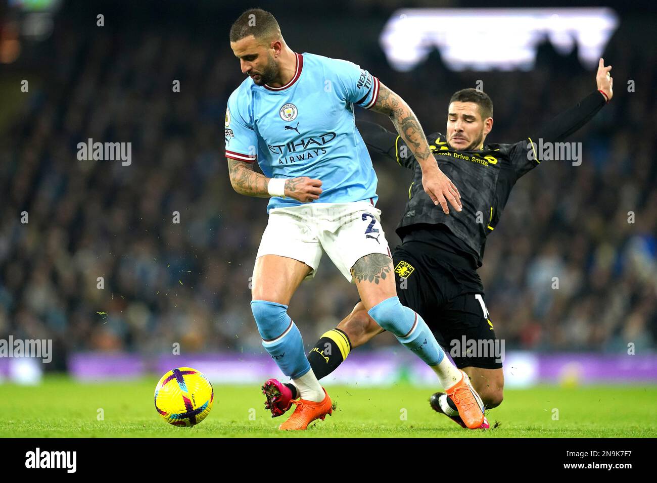 Manchester City's Kyle Walker (left) and Aston Villa's Emiliano Buendia ...