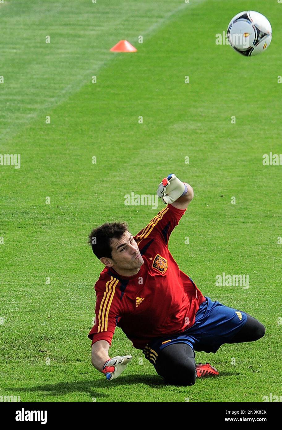 Spanish goalkeeper Iker Casillas tries to grab the ball during al ...