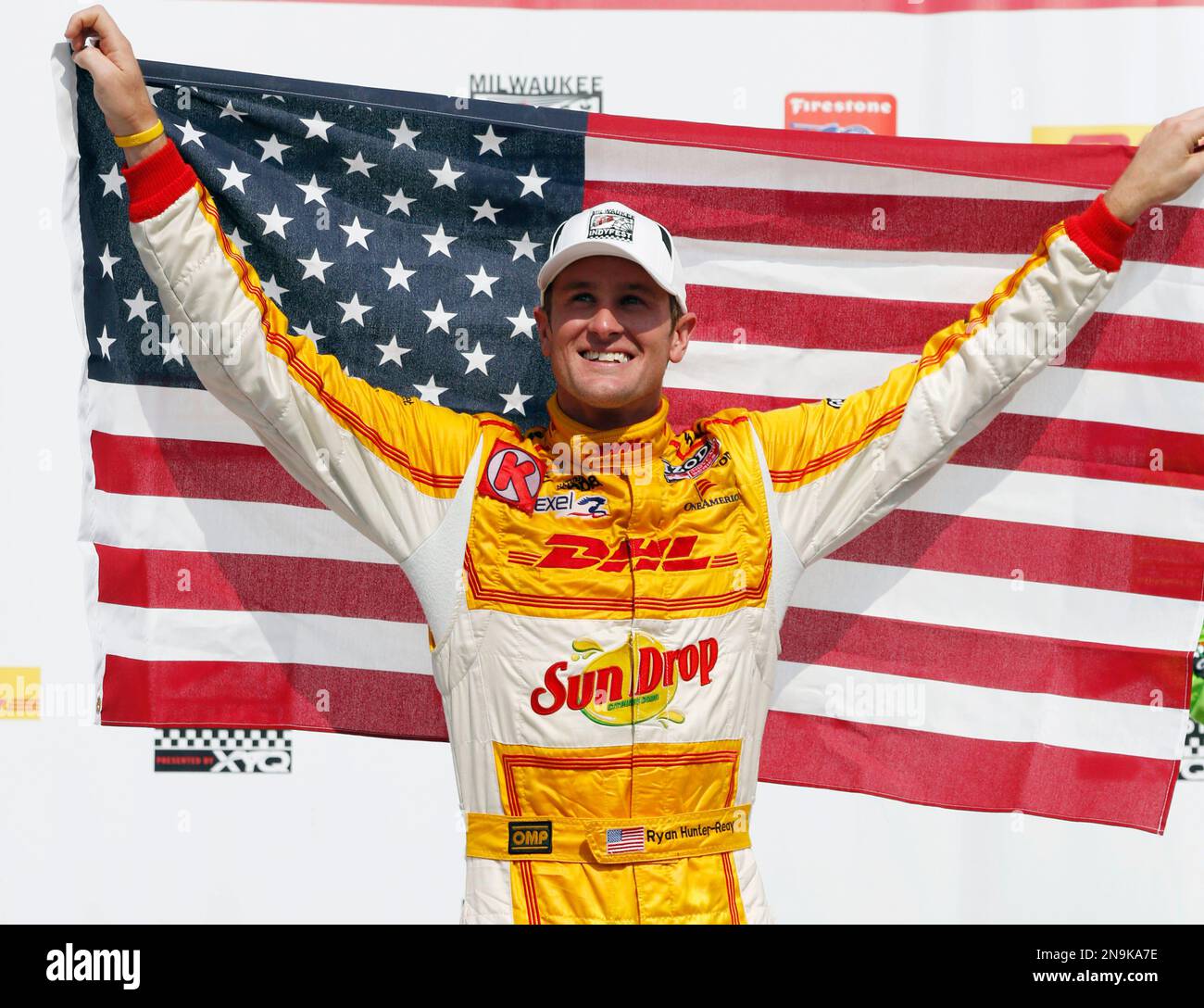 Ryan Hunter-Reay holds up a U.S. flag after winning the IndyCar auto ...