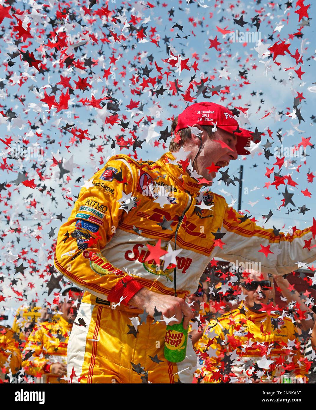 Ryan Hunter-Reay celebrates as confetti flies after he won the IndyCar ...