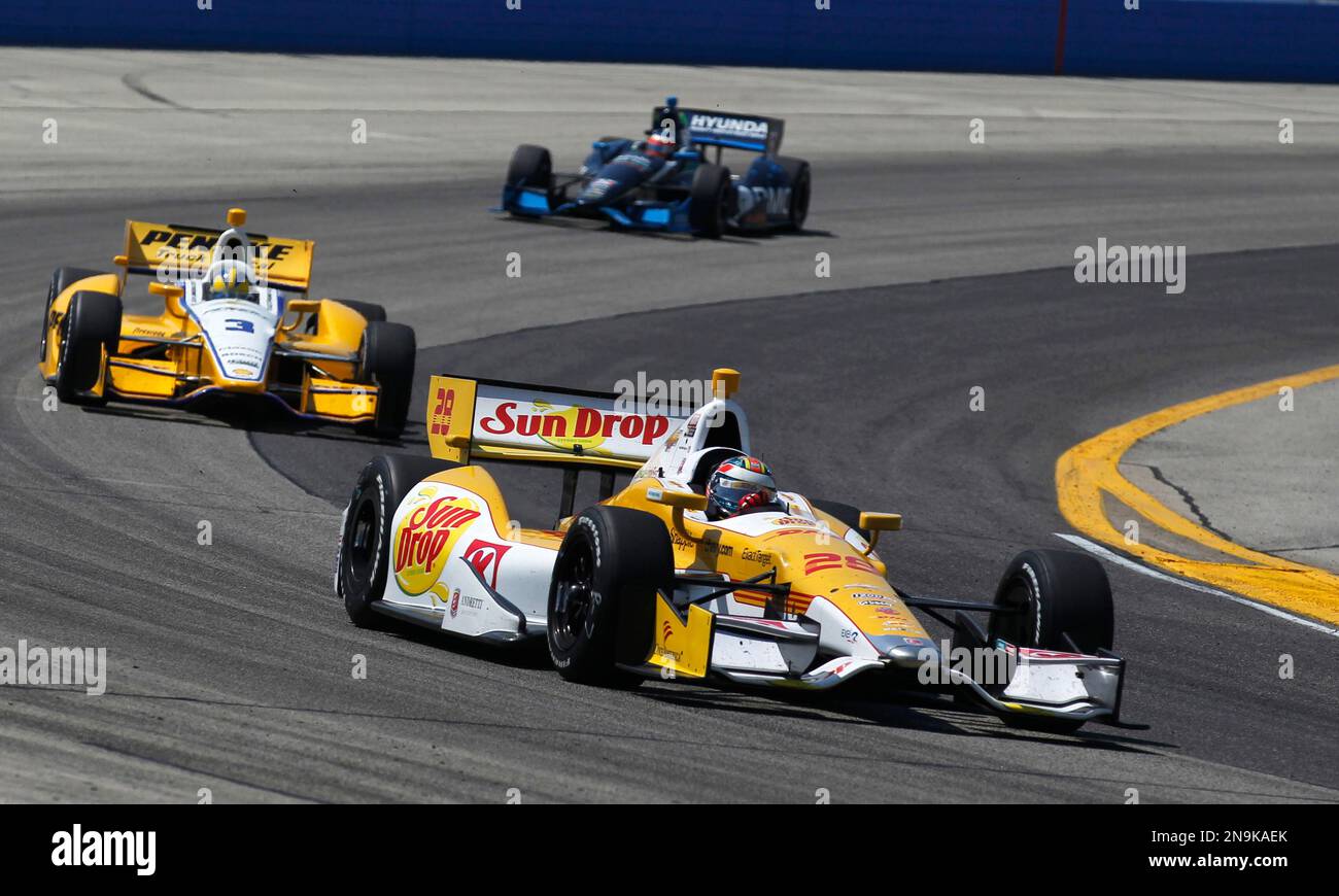 Ryan Hunter-Reay (28) and Helio Castroneves (3), of Brazil, drive ...