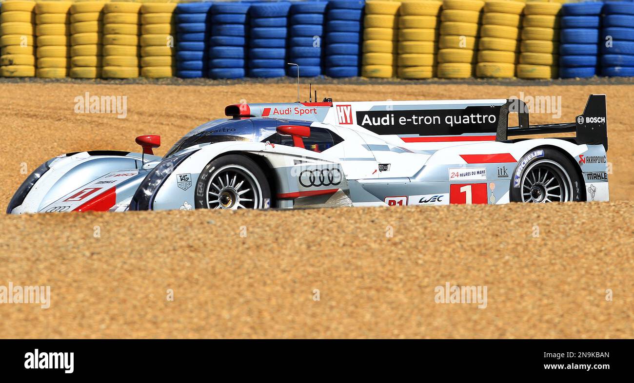 The Audi R18 TDI No1 driven by Andre Lotterer of Germany takes a curve ...