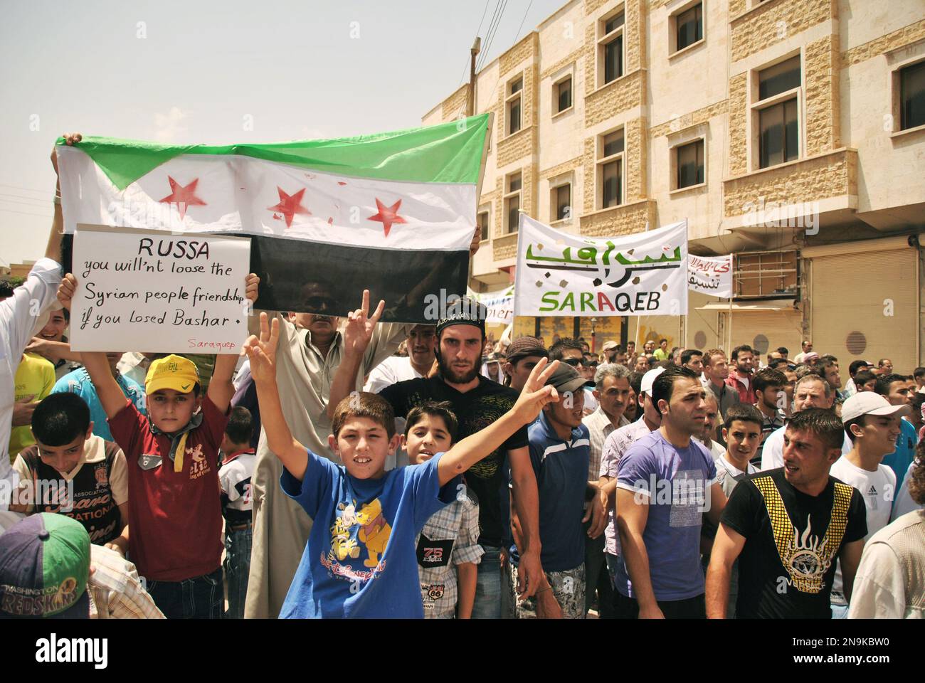In this Friday, June 15, 2012 photo, Syrians chant slogans during a ...