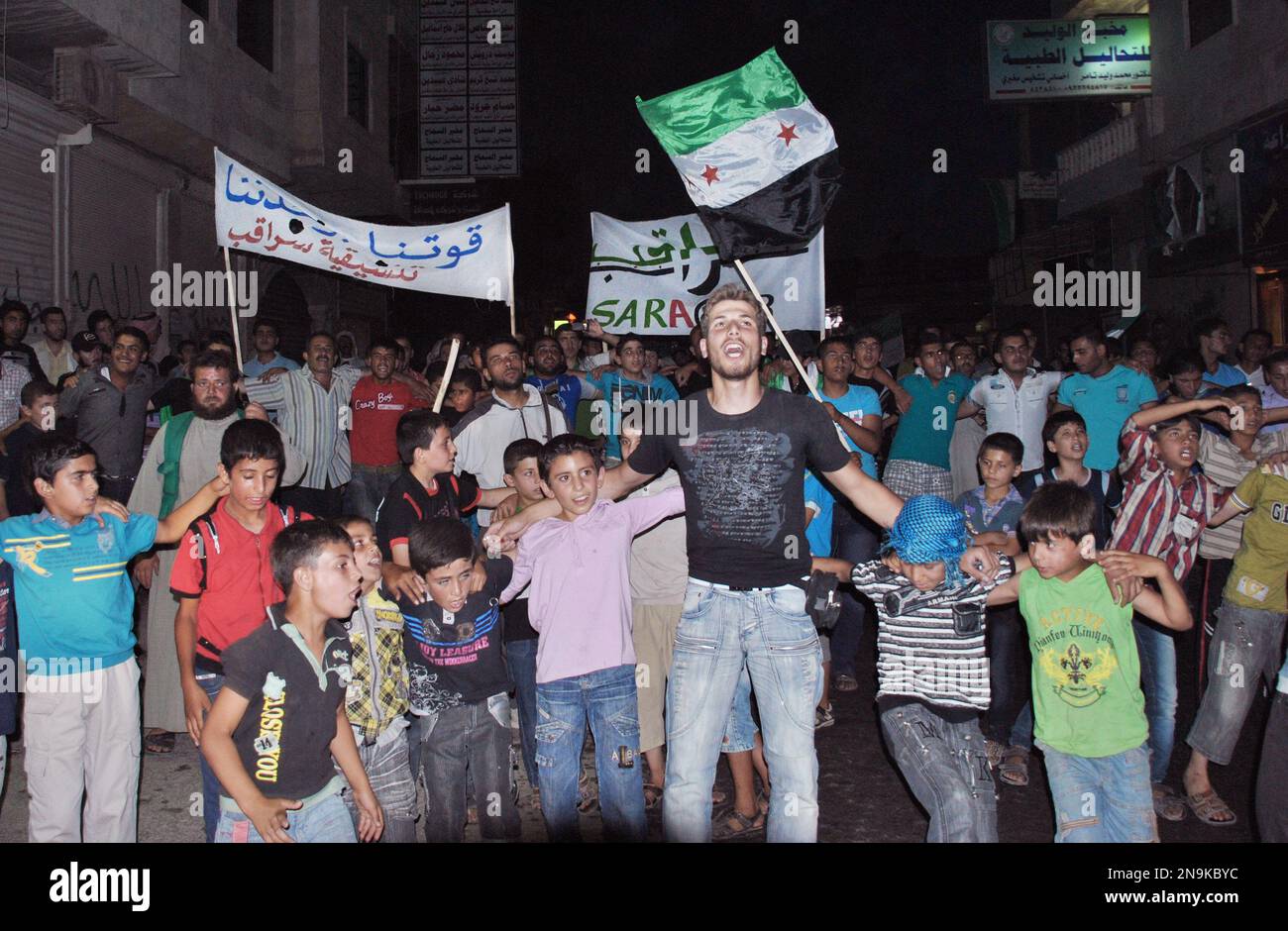 In this Thursday, June 14, 2012 photo, Syrians chant slogans during a ...