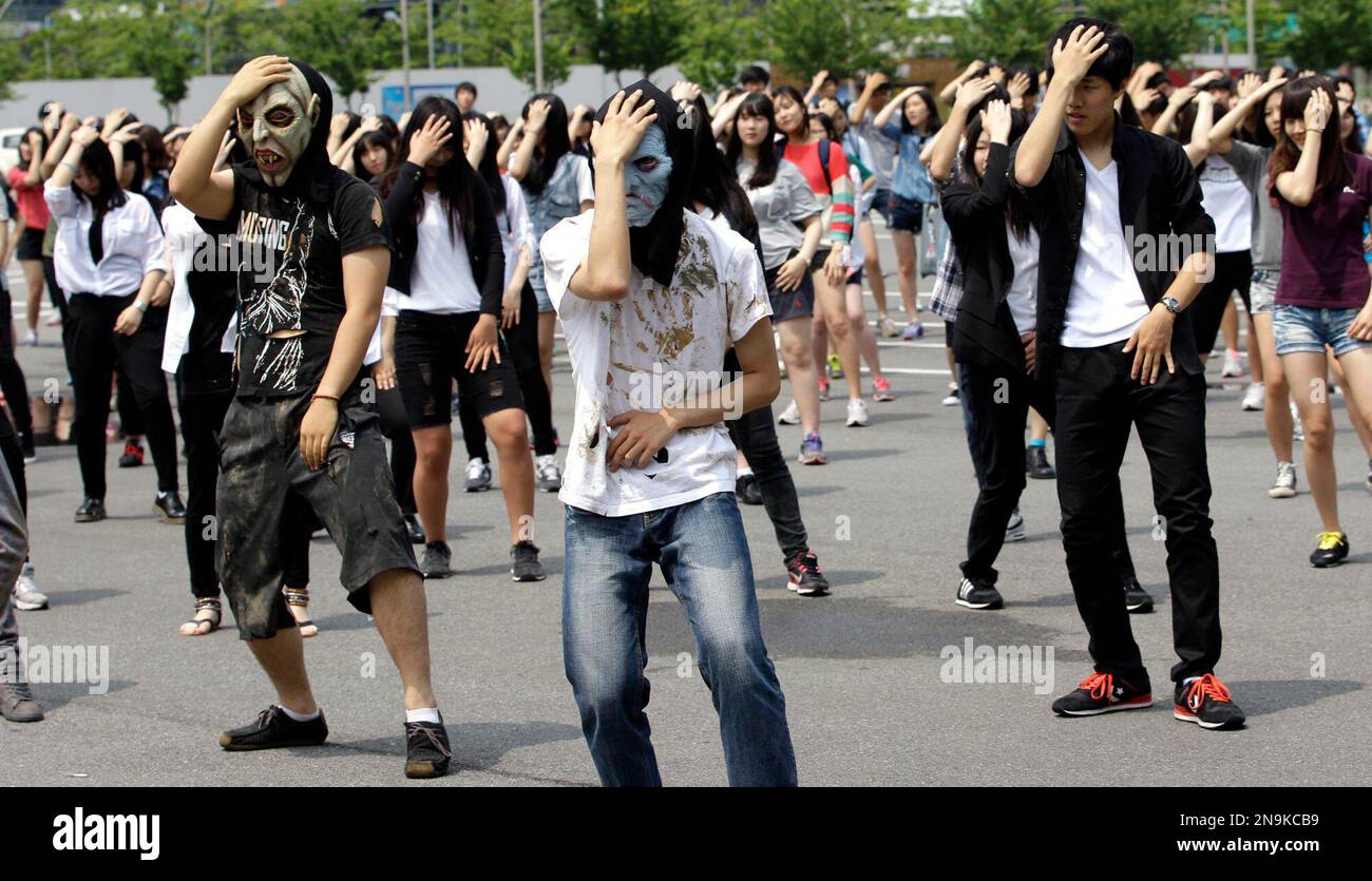 South Korean fans of the late U.S. pop star Michael Jackson dance during a flash mob event ...
