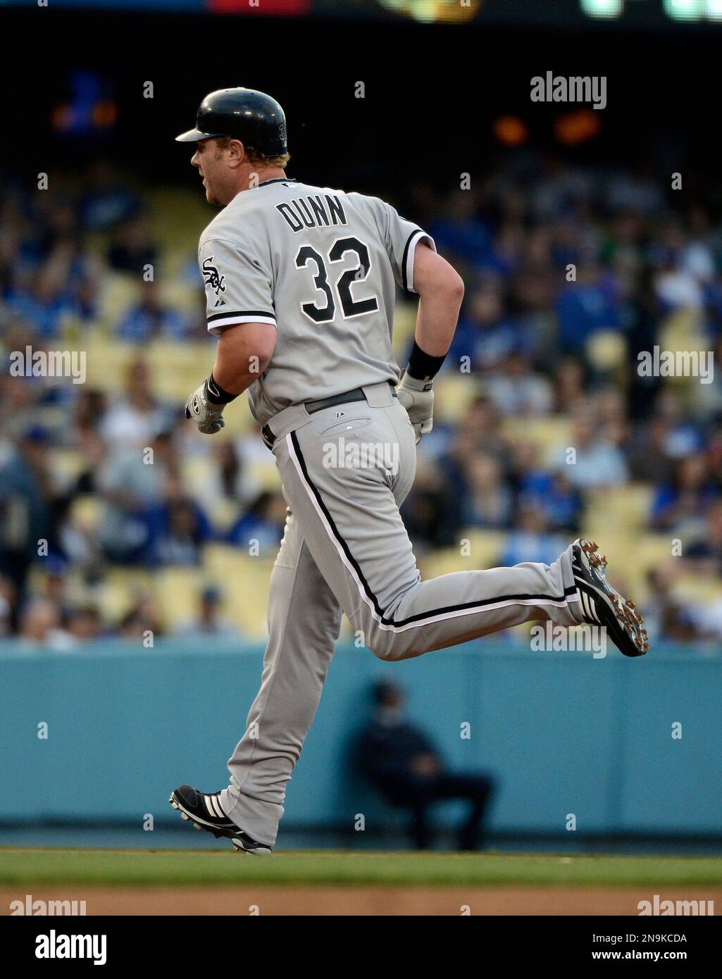 Chicago White Sox's Adam Dunn heads toward third after hitting a two ...