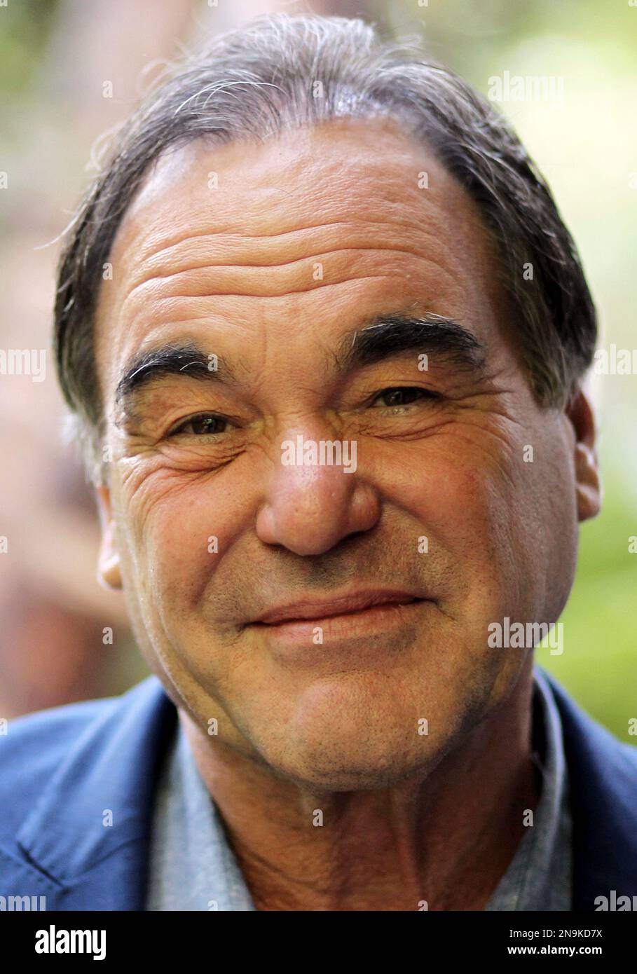 Director Oliver Stone, from the upcoming film "Savages", poses for a ...